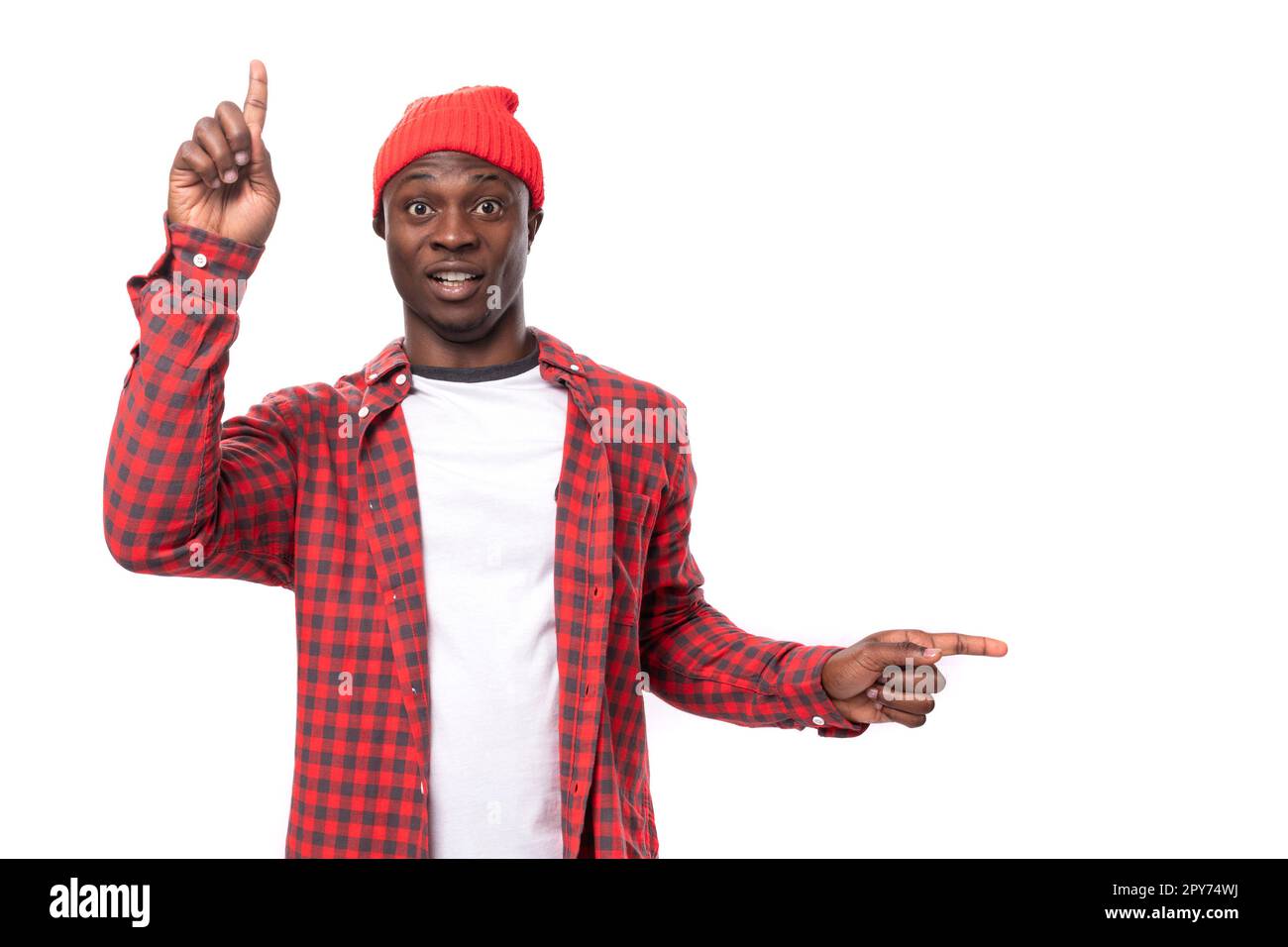 handsome dark-skinned man in casual style shows confidence with hand on ...
