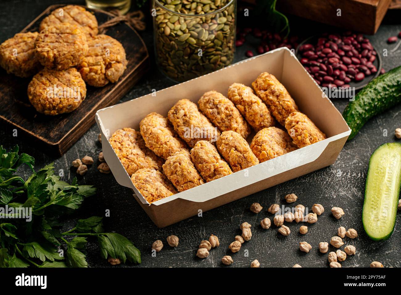 Portion of packed vegetarian cutlets in box Stock Photo - Alamy
