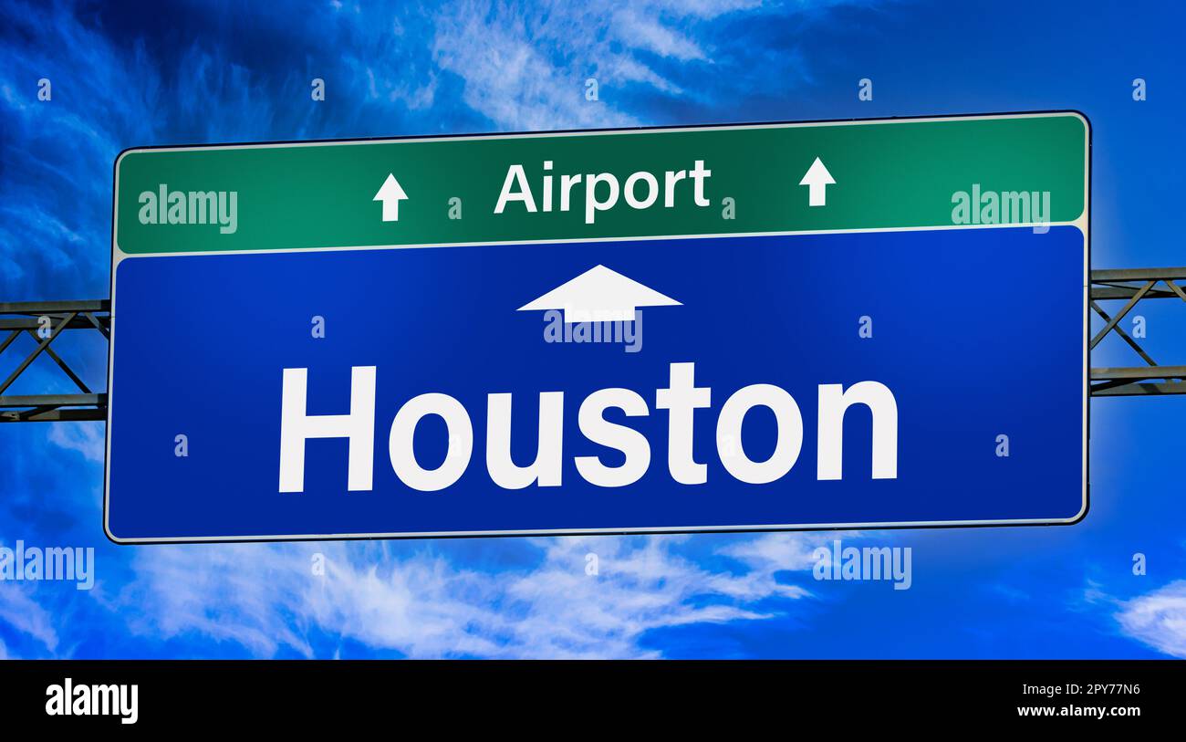 Road sign indicating direction to the city of Houston Stock Photo - Alamy