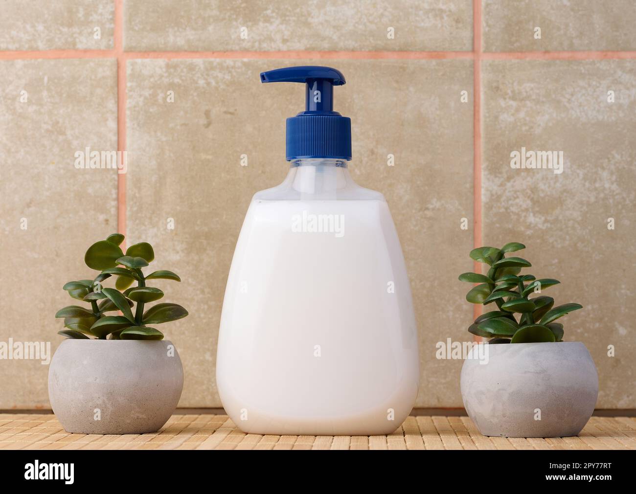 White plastic container with a pump for liquid products. Container for ...