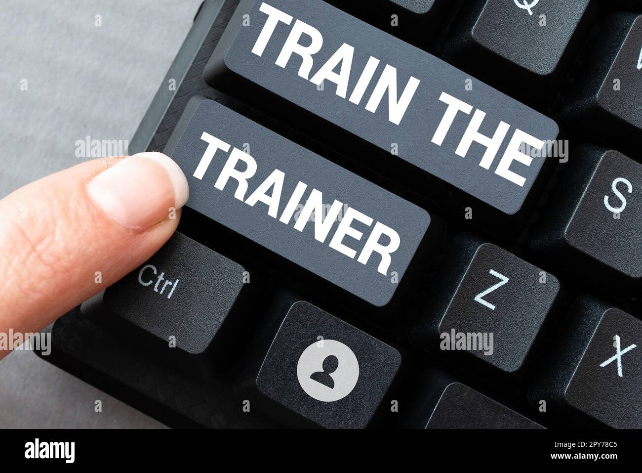 Text caption presenting Train The Trainer. Word Written on identified ...