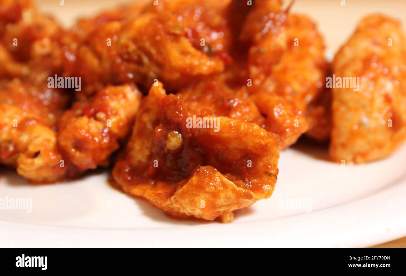 Fried Pork Skins With Red Salsa in Rustic Kitchen Stock Photo - Alamy