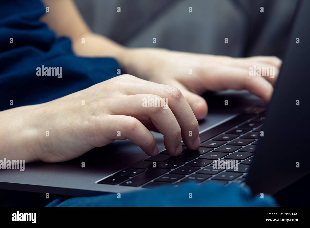 Unrecognizable man hands typing, using laptop keyboard knees. E ... Unrecognizable man hands typing, using laptop keyboard knees. E ...