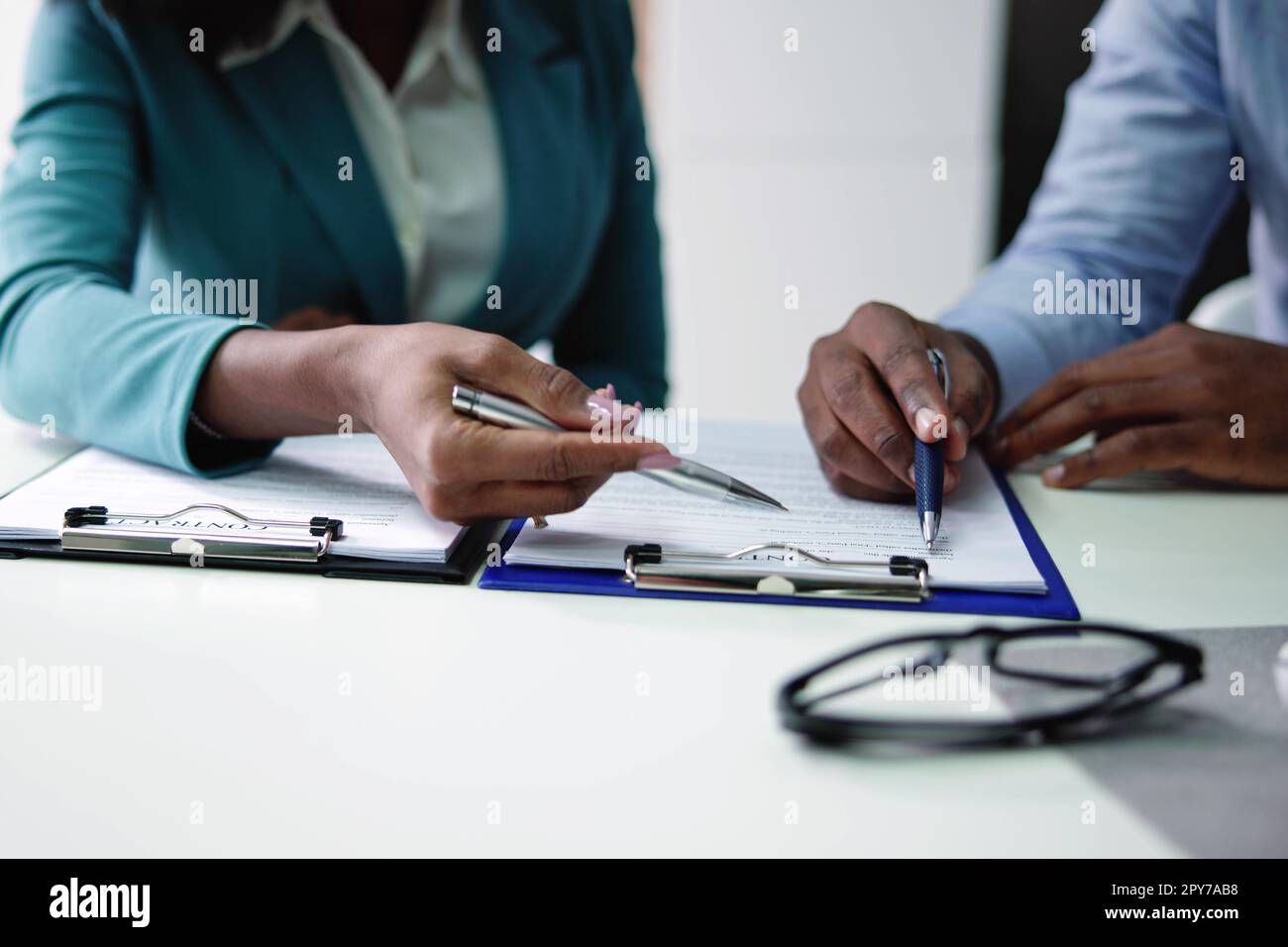 Two Businesspeople Hand Working Stock Photo - Alamy