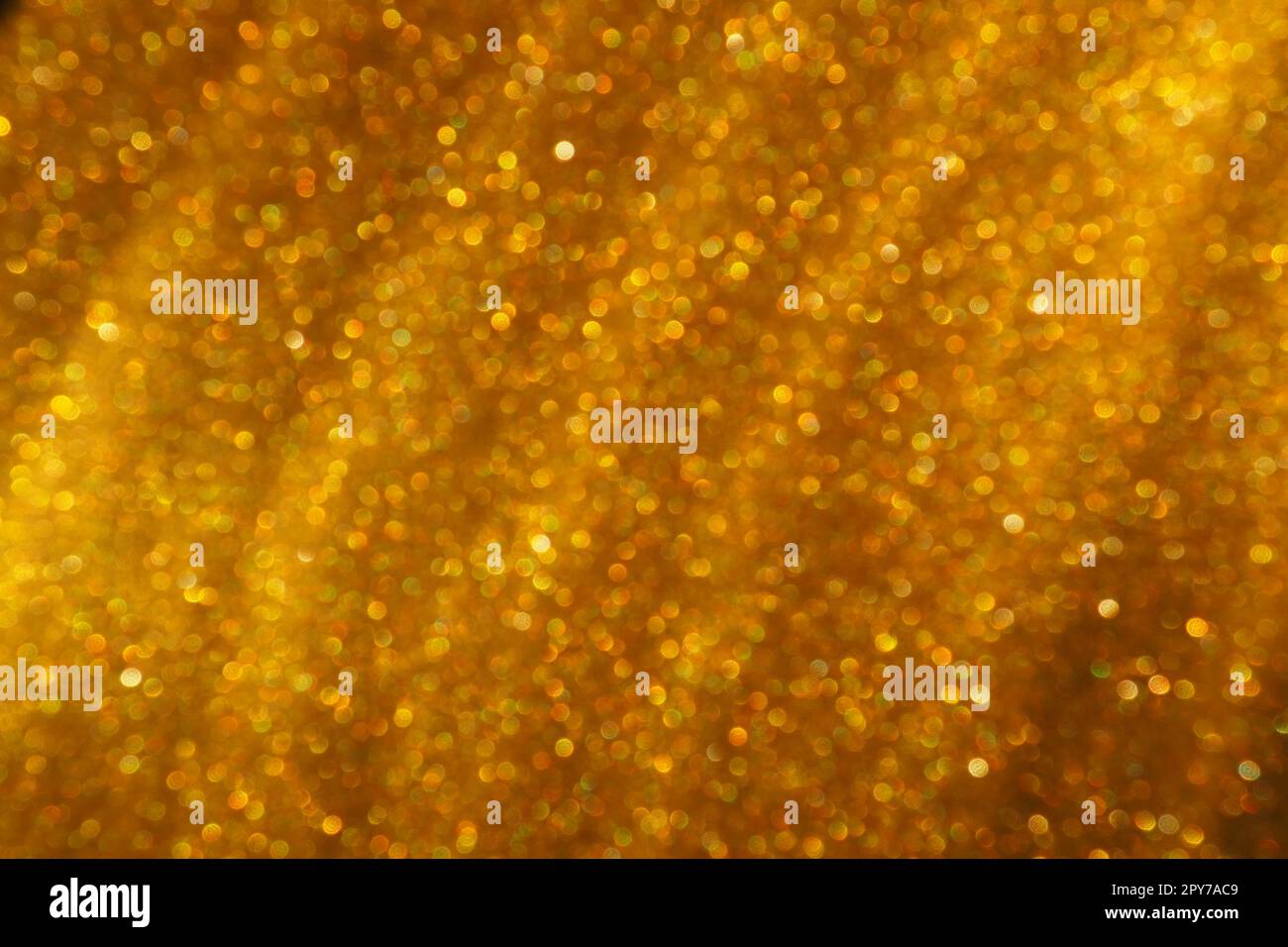 Bokeh light of gold glitters. Golden glitter texture background ...