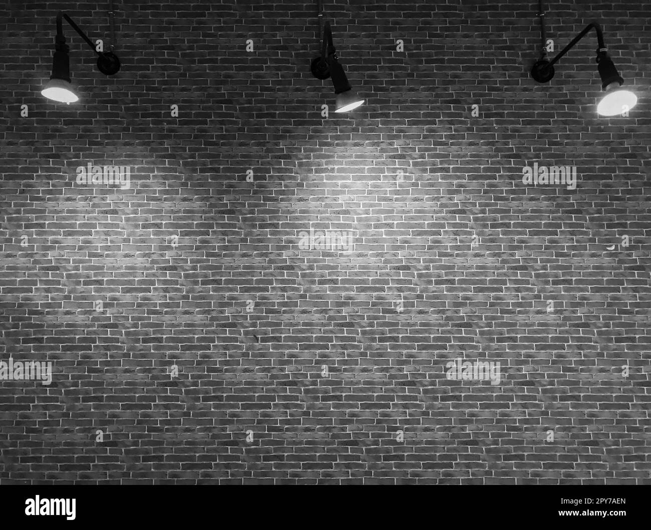 Spot light and brick background Stock Photo - Alamy