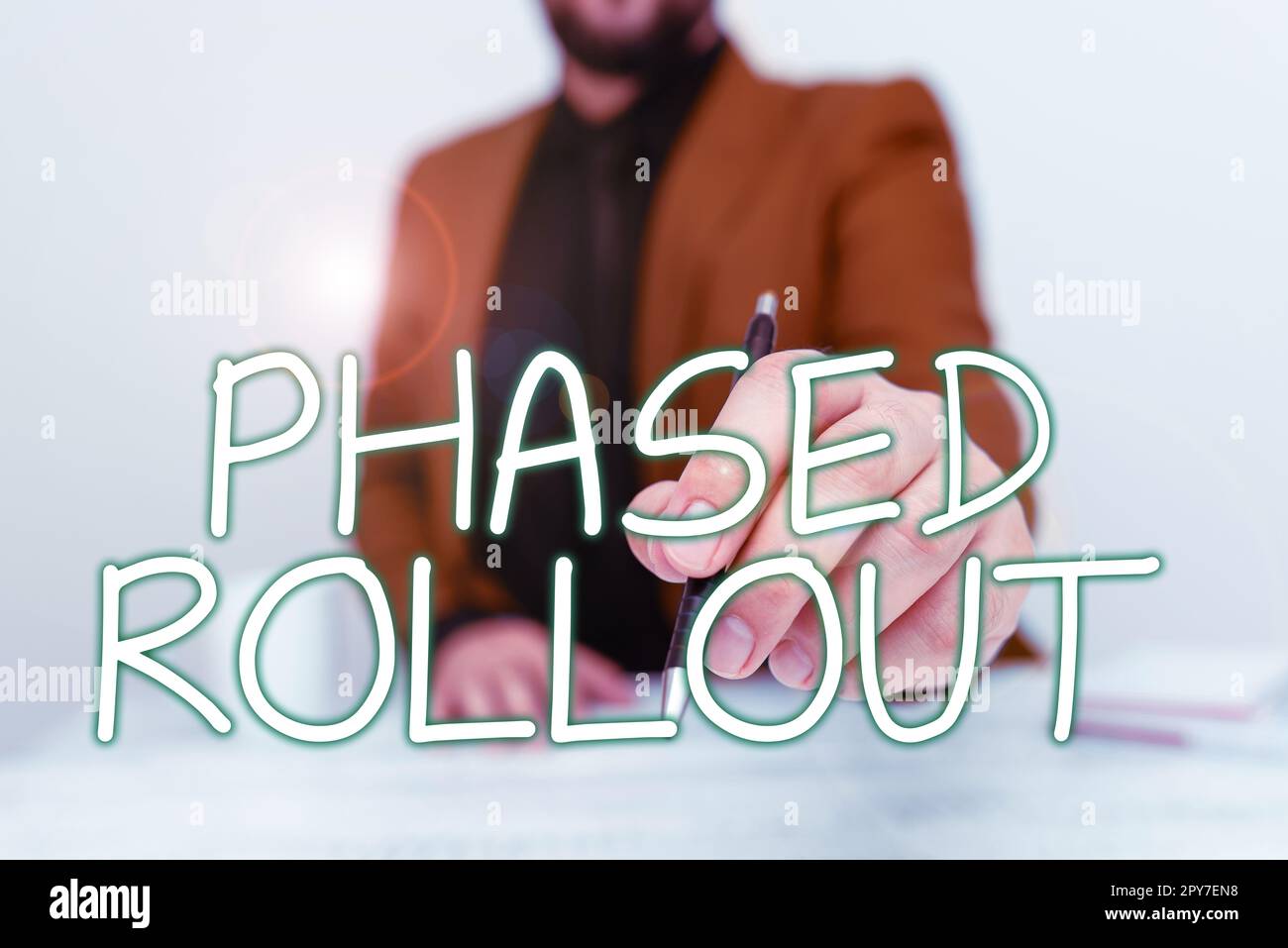 Hand writing sign Phased Rollout. Word Written on the practice of ...