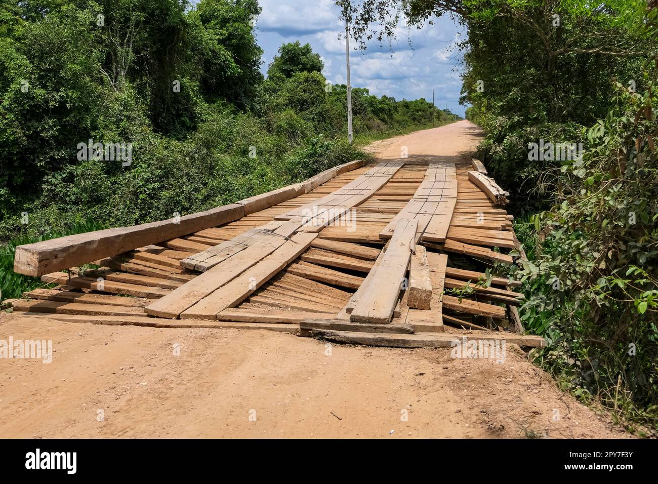 Typical run-down wooden bridge of the Transpantaneira crossing a river ...