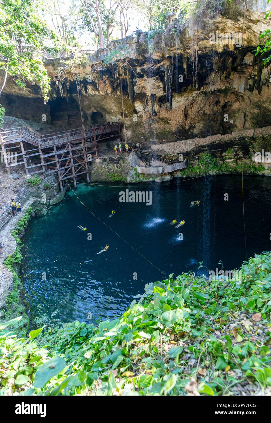 People swimming in Cenote Zaci carboniferous limestone swallow hole ...