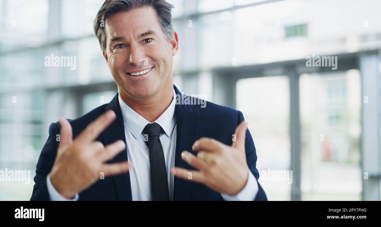 Business couldnt be better. a mature businessman showing a shaka hand ...