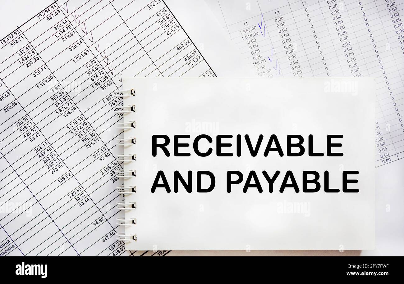 Business concept. On documents with reports, a notepad with the ...