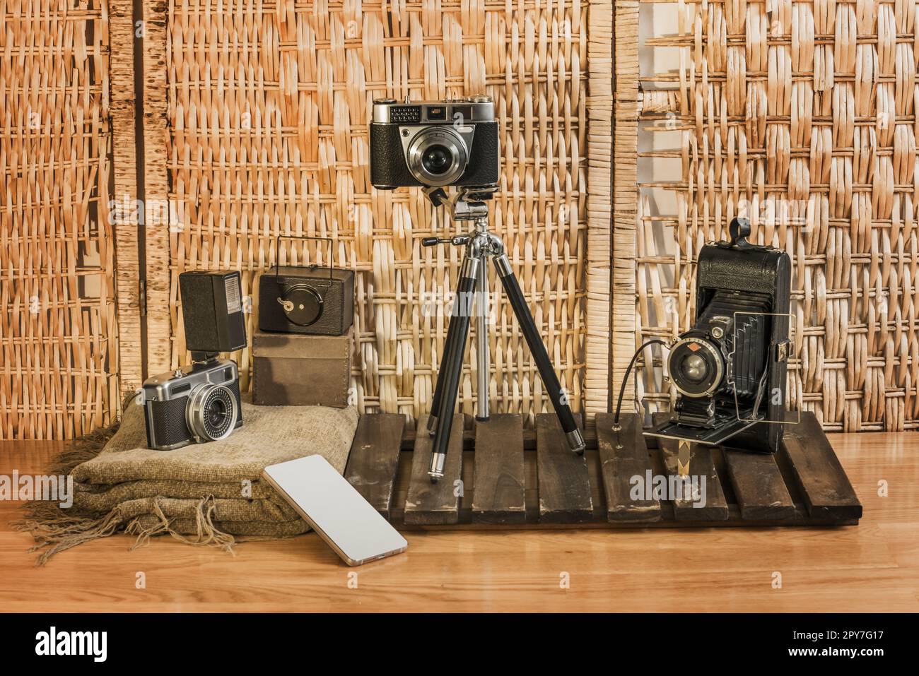 A group of vintage cameras in a warm wood and wicker setting Stock ...