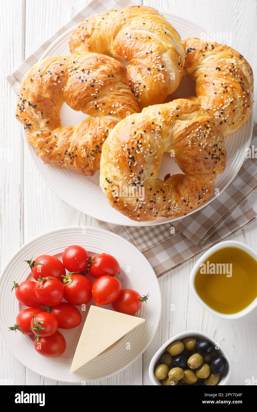 Traditional Turkish acma bread buns with olive oil, olives, cheese ...