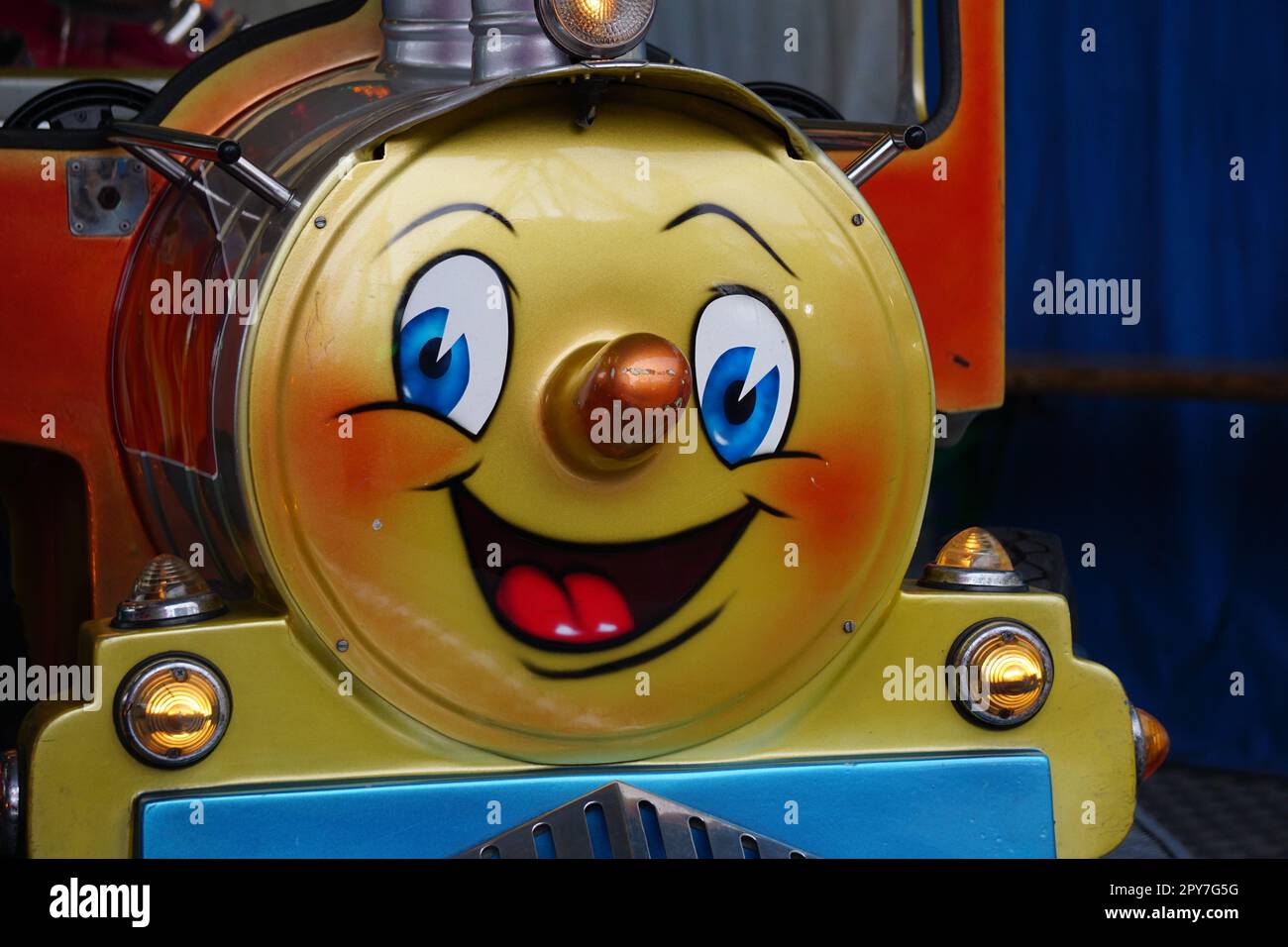 A vintage locomotive with an artfully painted face on its front Stock ...