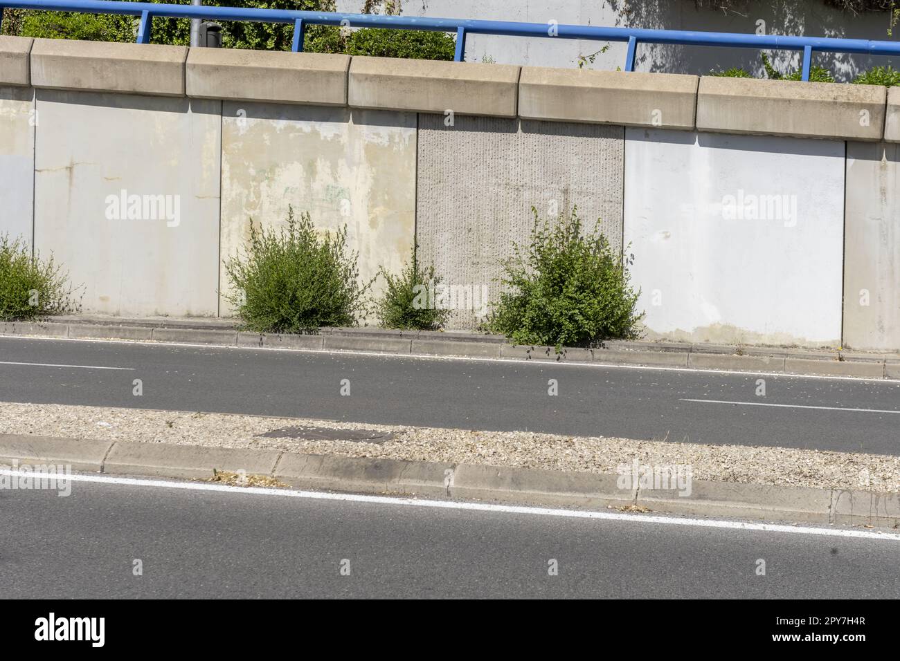 An urban highway with a median dividing both directions and a ramp with ...