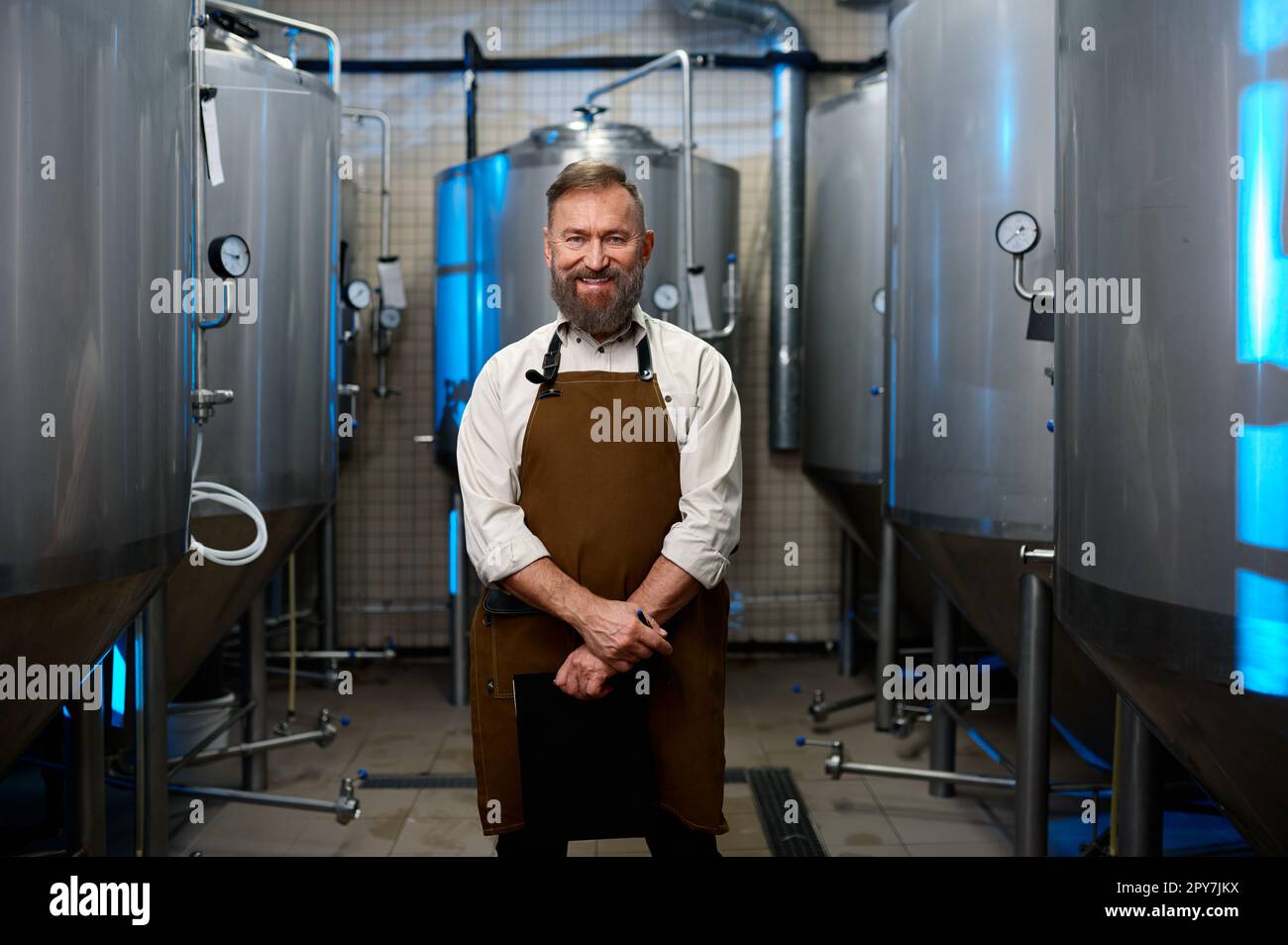 Happy male brewer in apron hi-res stock photography and images - Alamy