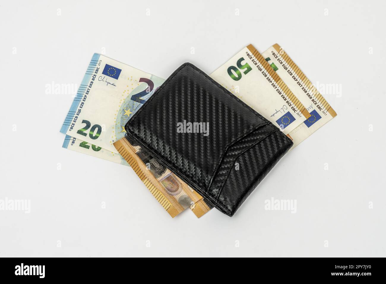 a black carbon fiber male wallet with debit cards and many euros Stock ...