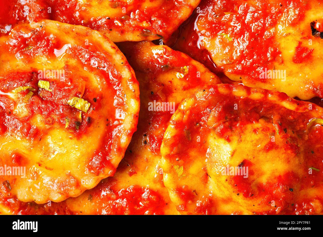 italian ravioli in tomato sauce food background Stock Photo - Alamy