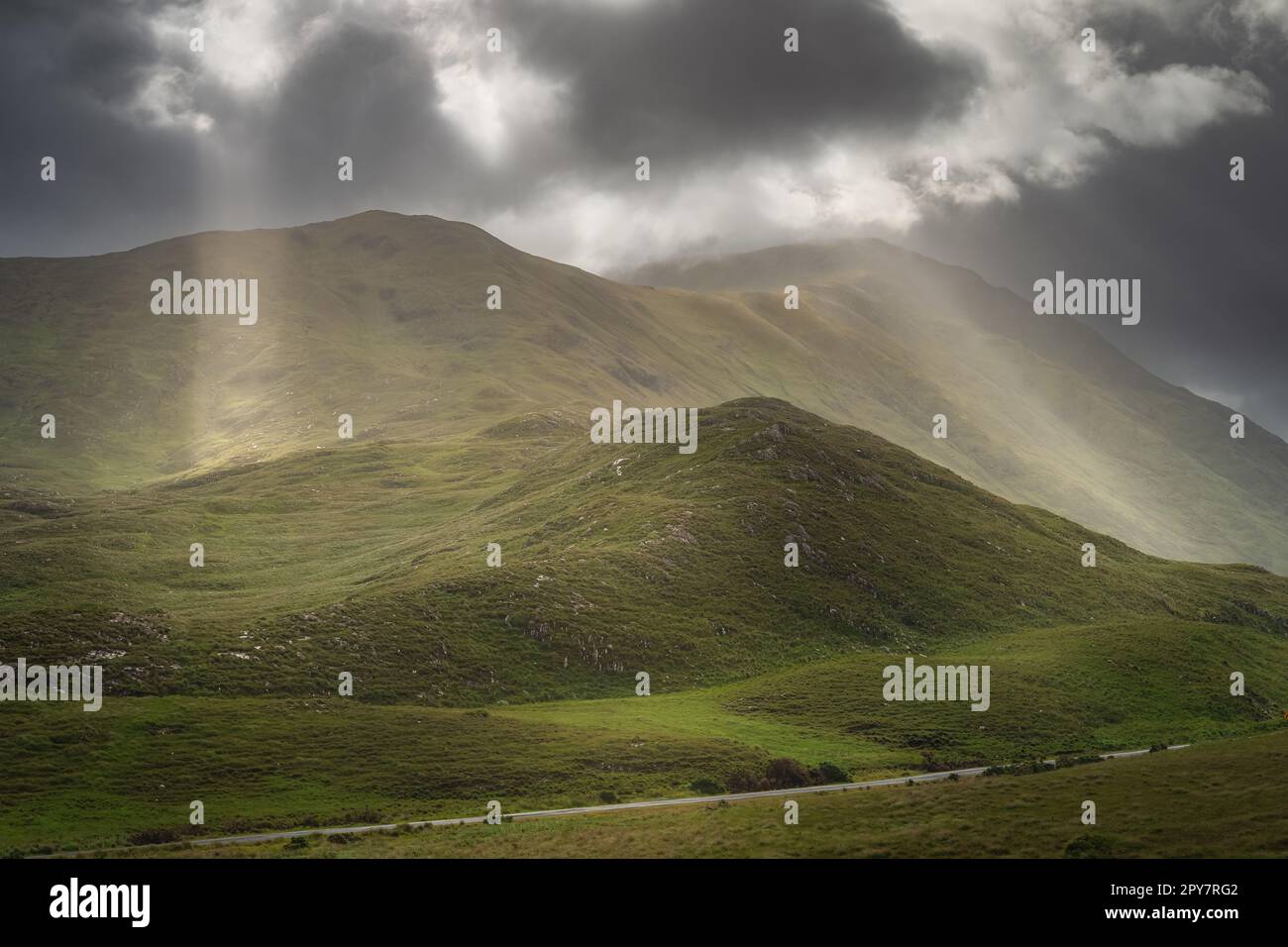 Doolough Valley, Glenummera and Glencullin mountain ranges illuminated ...