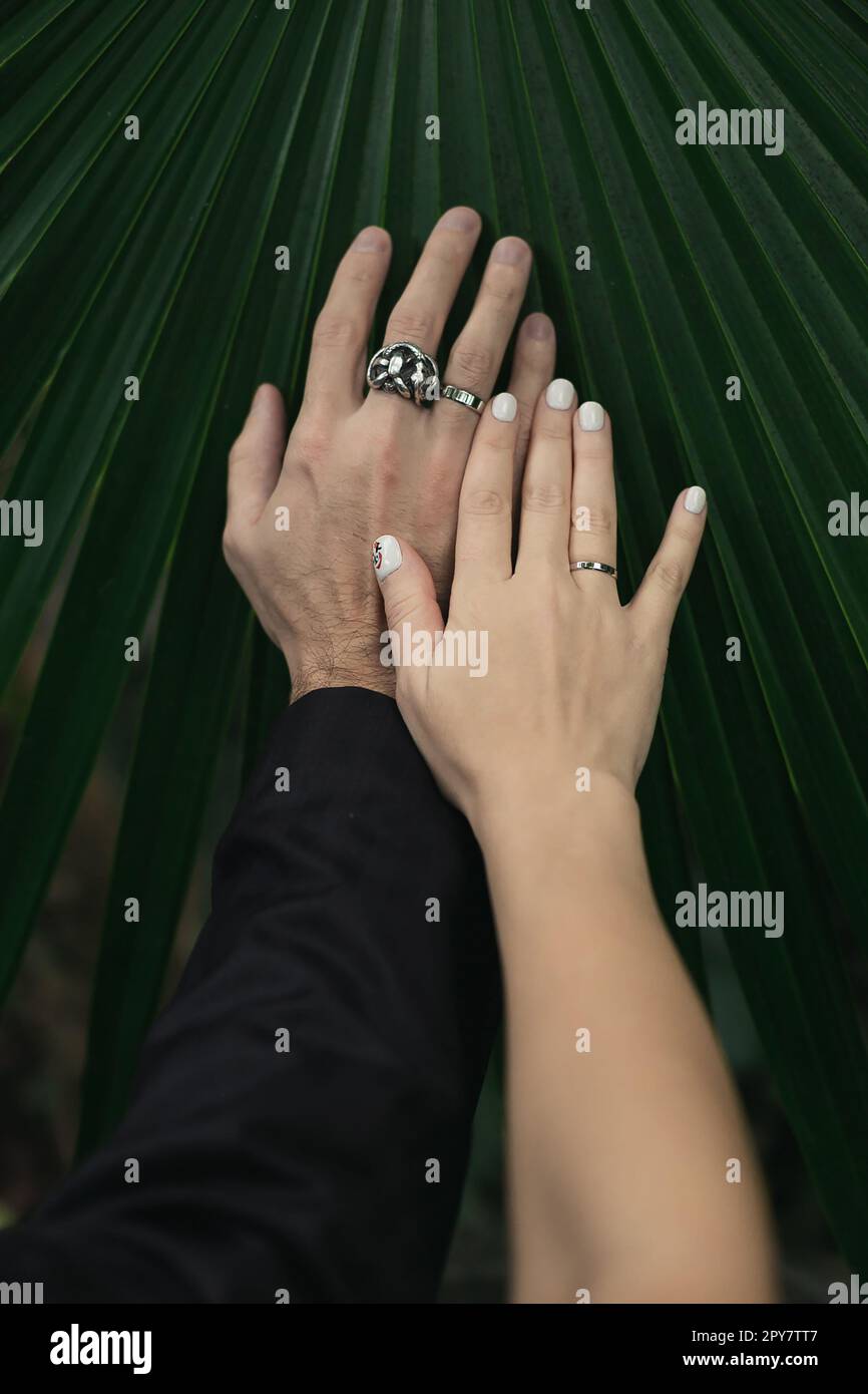 Close up wedding rings on hands concept photo Stock Photo - Alamy