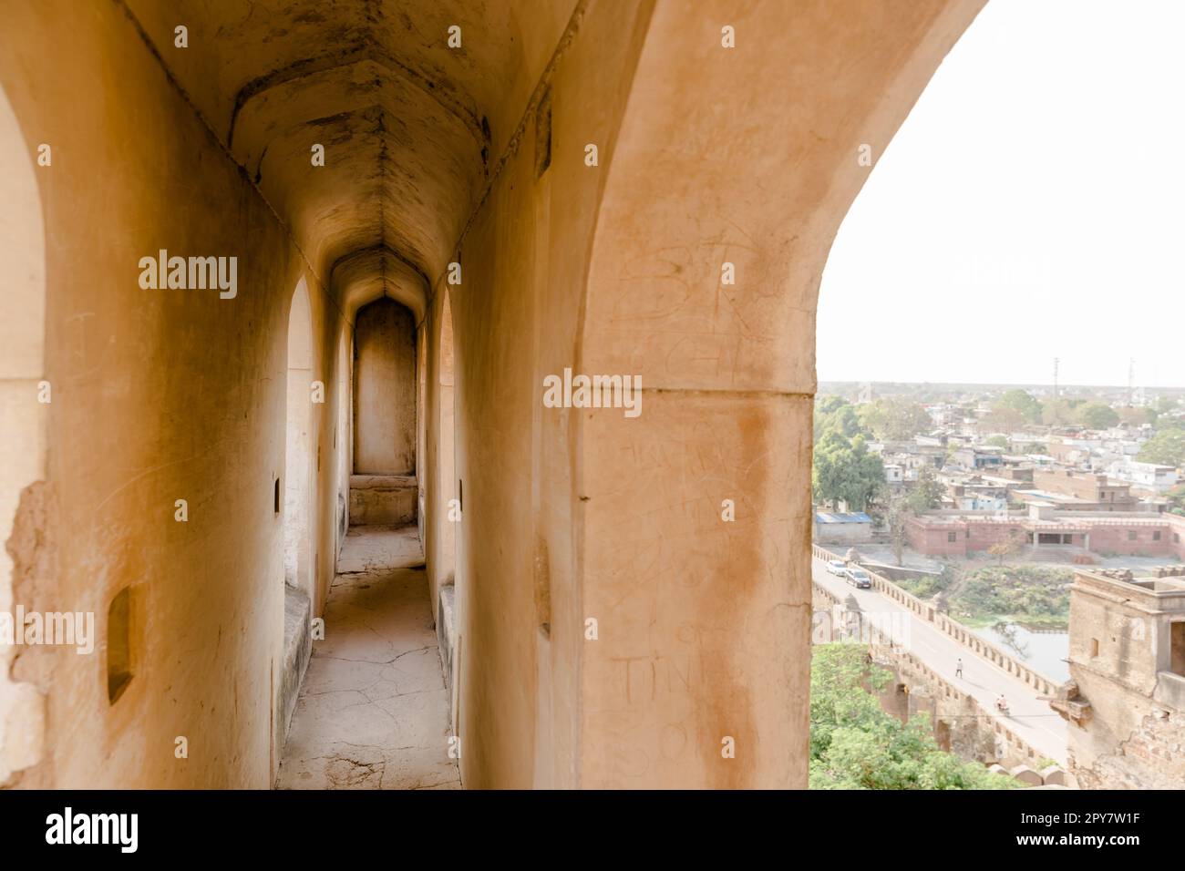 The narrow corridor of the historic Orchha Fort in India, with its ...