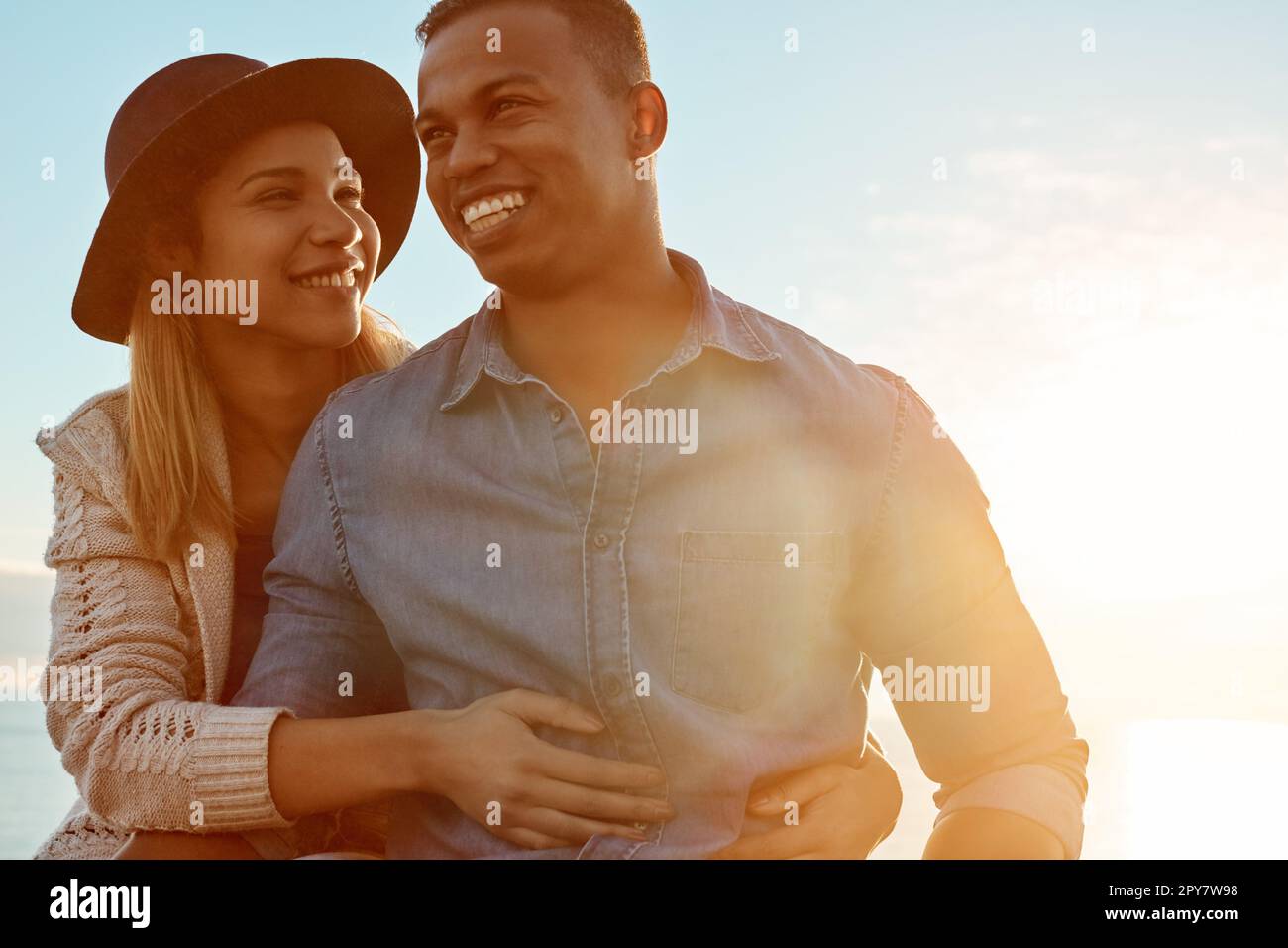 Hes so handsome and hes all mine. a happy young couple enjoying a ...