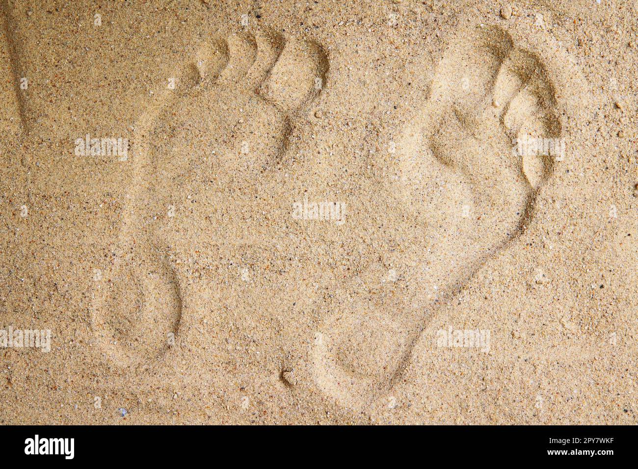 human feet print in the sand as nice background Stock Photo - Alamy