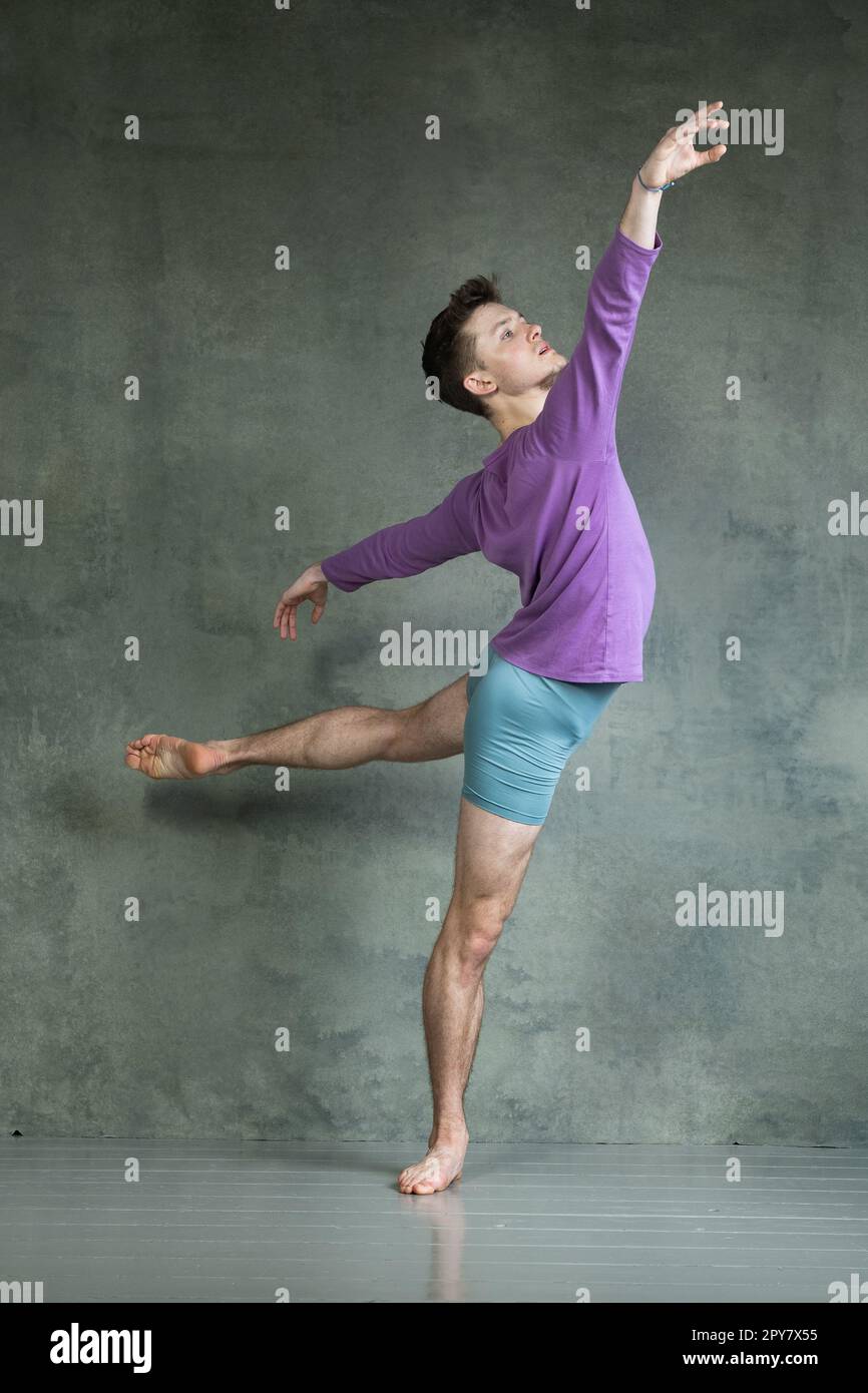 Male dancer in dyanmic dance pose in photo studio Stock Photo - Alamy