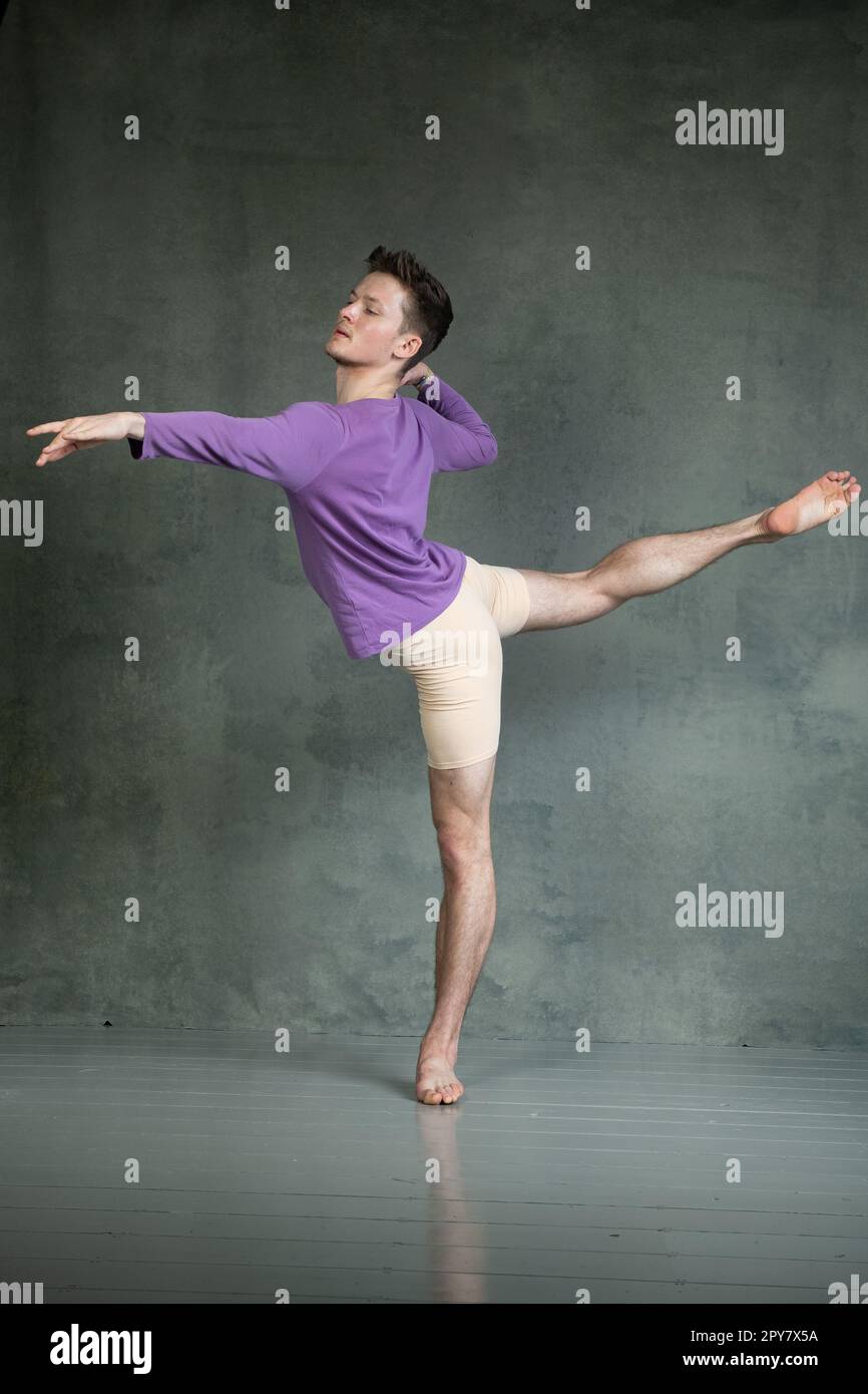 Male dancer in dyanmic dance pose in photo studio Stock Photo - Alamy