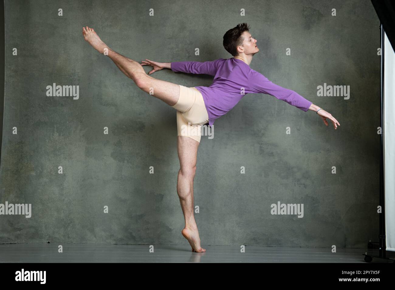 Male dancer in dyanmic dance pose in photo studio Stock Photo - Alamy