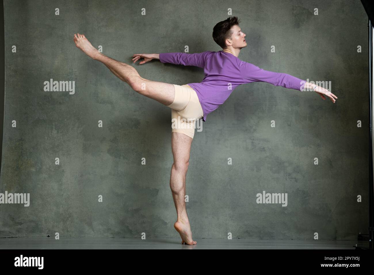 Male dancer in dyanmic dance pose in photo studio Stock Photo - Alamy