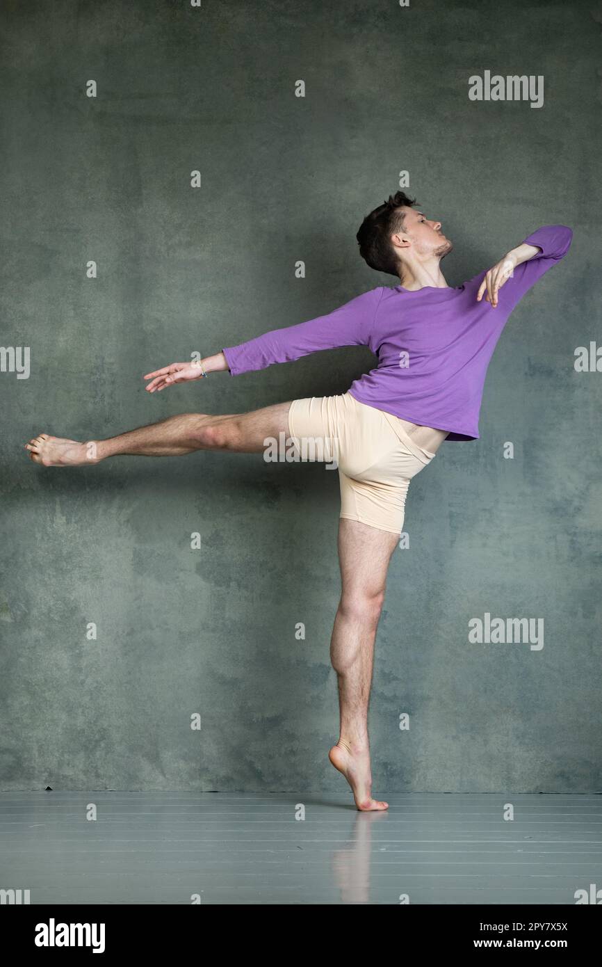 Male dancer in dyanmic dance pose in photo studio Stock Photo - Alamy