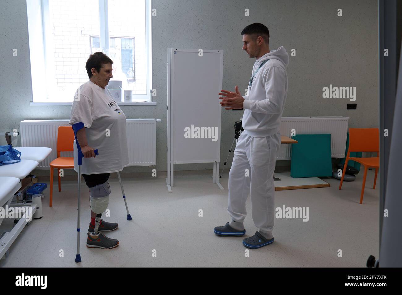 VYNNYKY, UKRAINE - MAY 1, 2023 - Physiotherapist Vitalii Marchenko ...