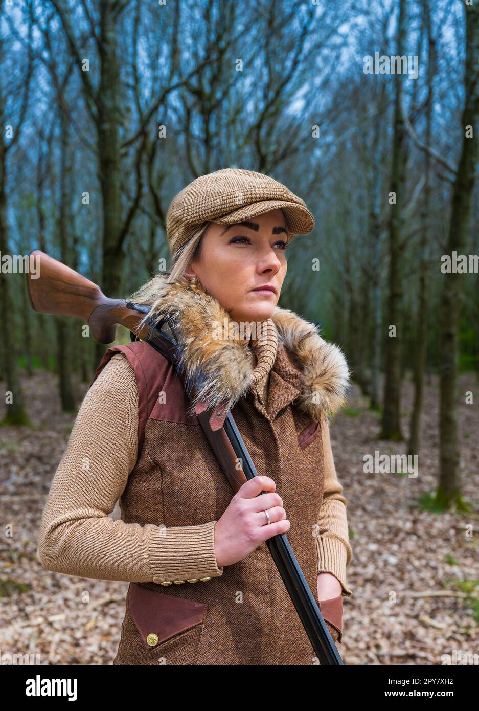 A thirty plus year old woman shooting in woodlands in the late spring ...