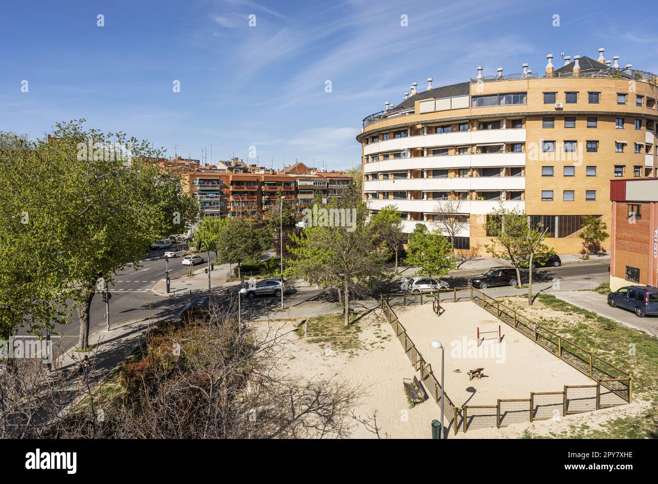 Views of the city with a circular-shaped building and a park for ...
