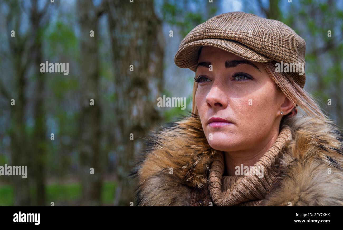 A thirty plus year old woman shooting in woodlands in the late spring ...