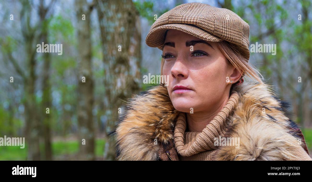 A thirty plus year old woman shooting in woodlands in the late spring ...