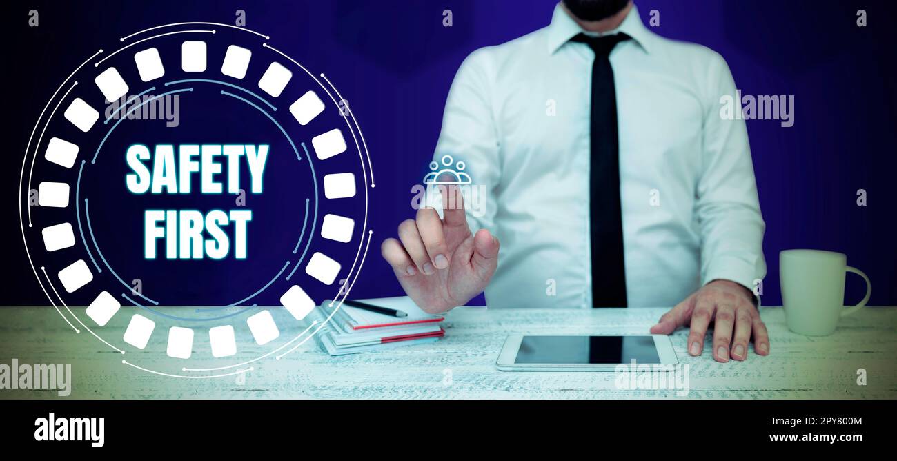 Hand writing sign Safety First. Word for Avoid any unnecessary risk ...