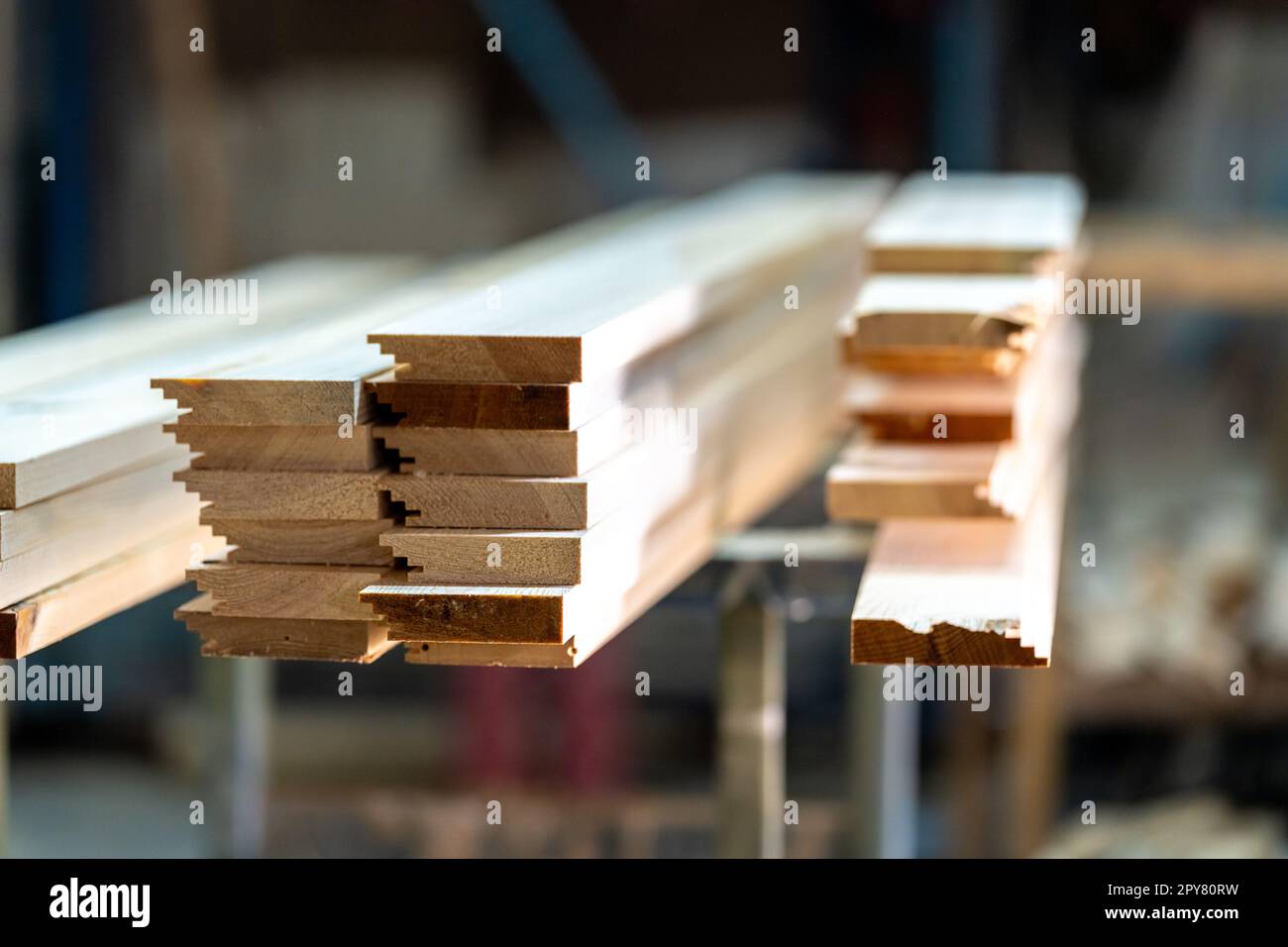 wooden boards on a rack in a carpentry shop Stock Photo - Alamy