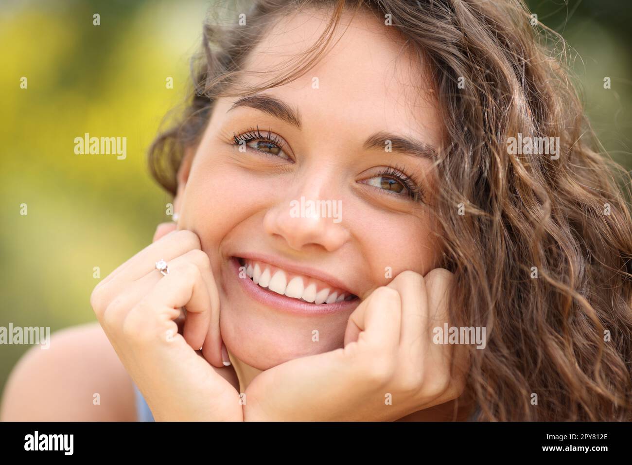Happy fiancee smiling looking away Stock Photo - Alamy