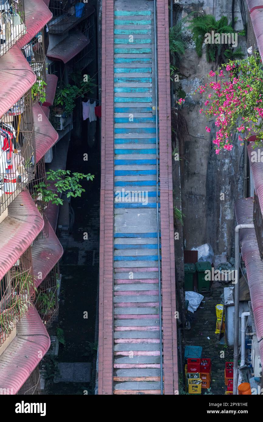 CHONGQING, CHINA - MAY 1, 2023 - A narrow and steep rainbow staircase ...