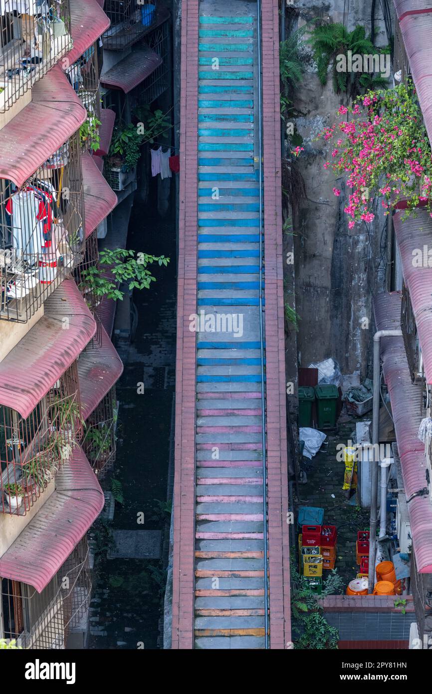 CHONGQING, CHINA - MAY 1, 2023 - A narrow and steep rainbow staircase ...