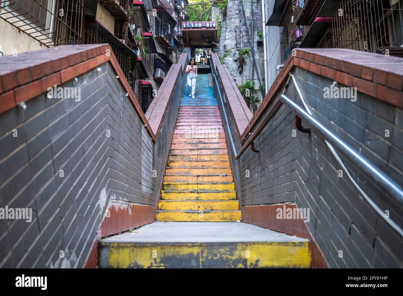 CHONGQING, CHINA - MAY 1, 2023 - A narrow and steep rainbow staircase ...