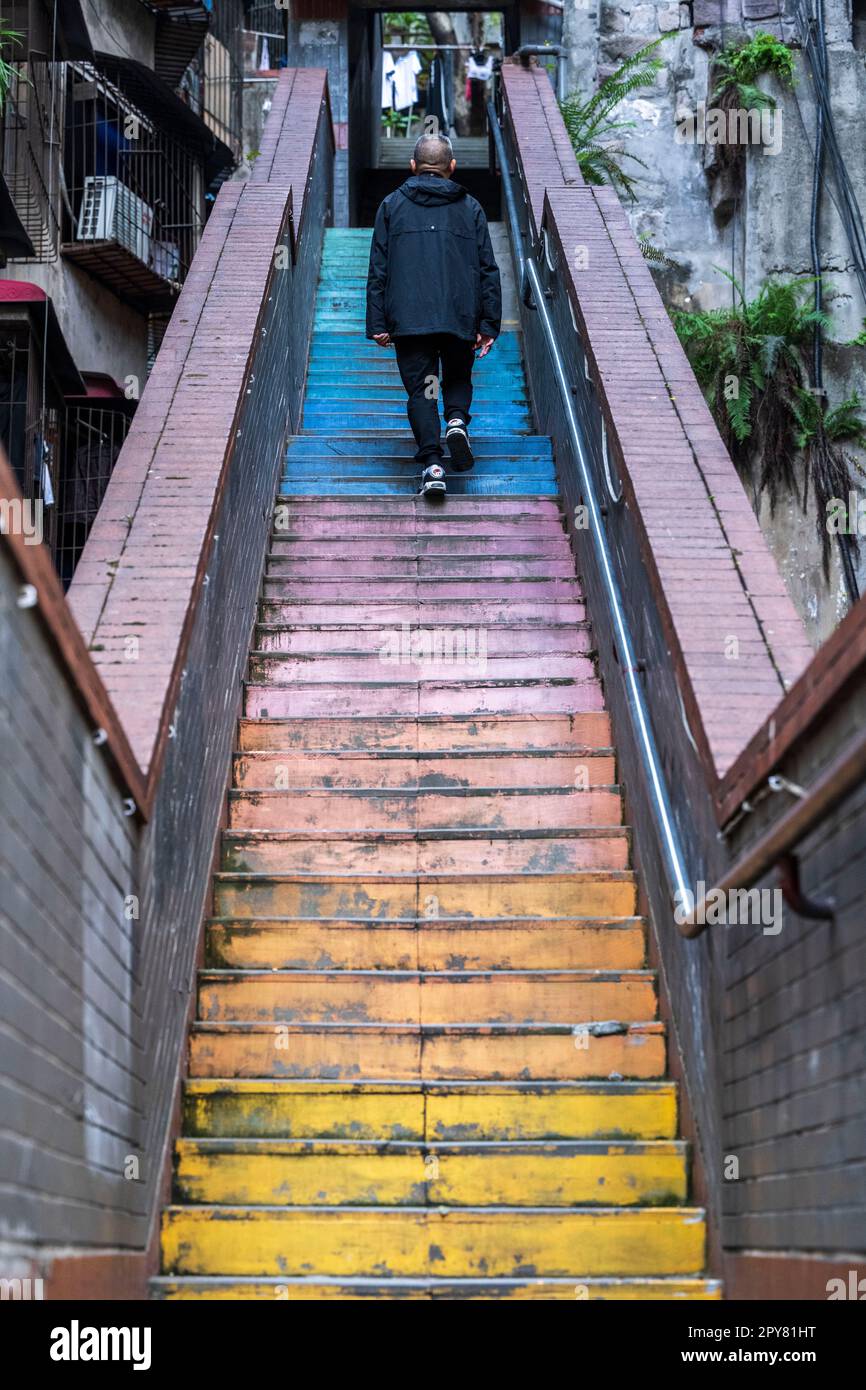 CHONGQING, CHINA - MAY 1, 2023 - A narrow and steep rainbow staircase ...