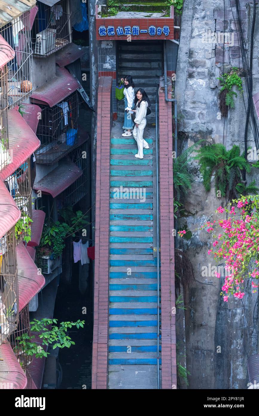 CHONGQING, CHINA - MAY 1, 2023 - A narrow and steep rainbow staircase ...