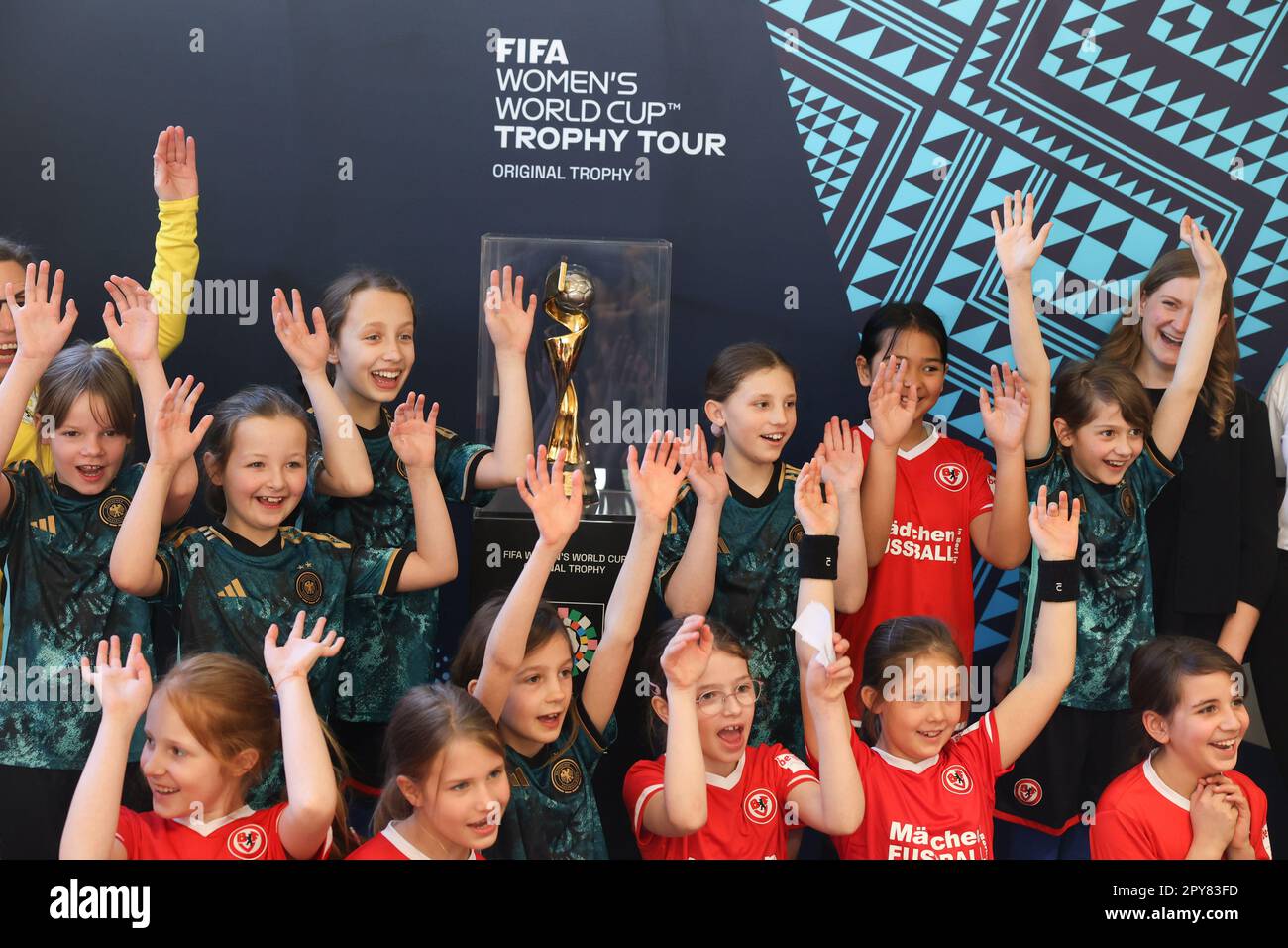 03 May 2023, Berlin: As part of the FIFA Trophy Tour, girls from a ...