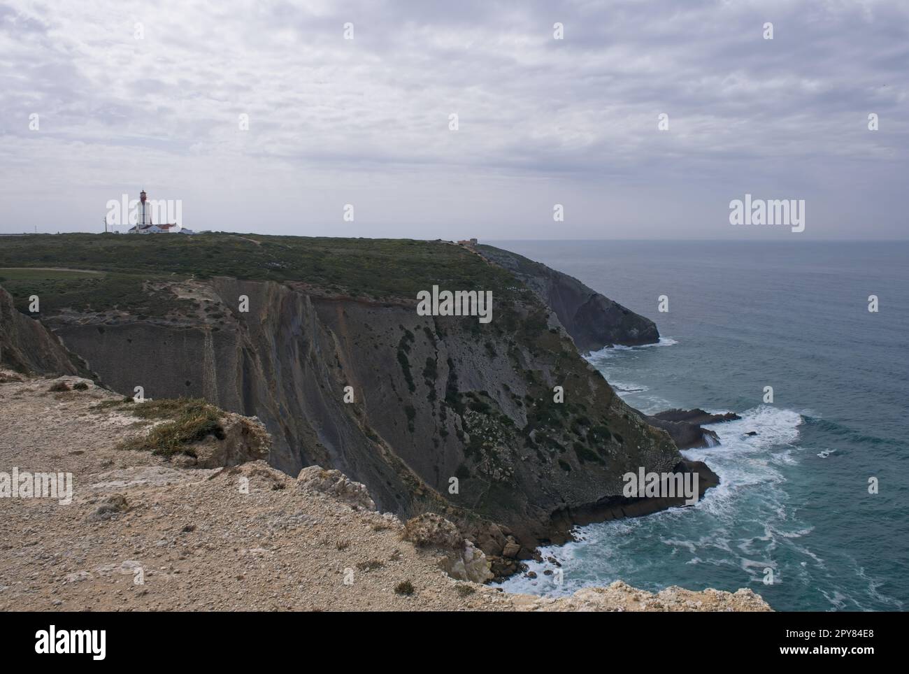 Sesimbra, Portugal - April 4, 2023: Cape Espichel Lighthouse (Lighthouse Cabo Espichel) is a ...