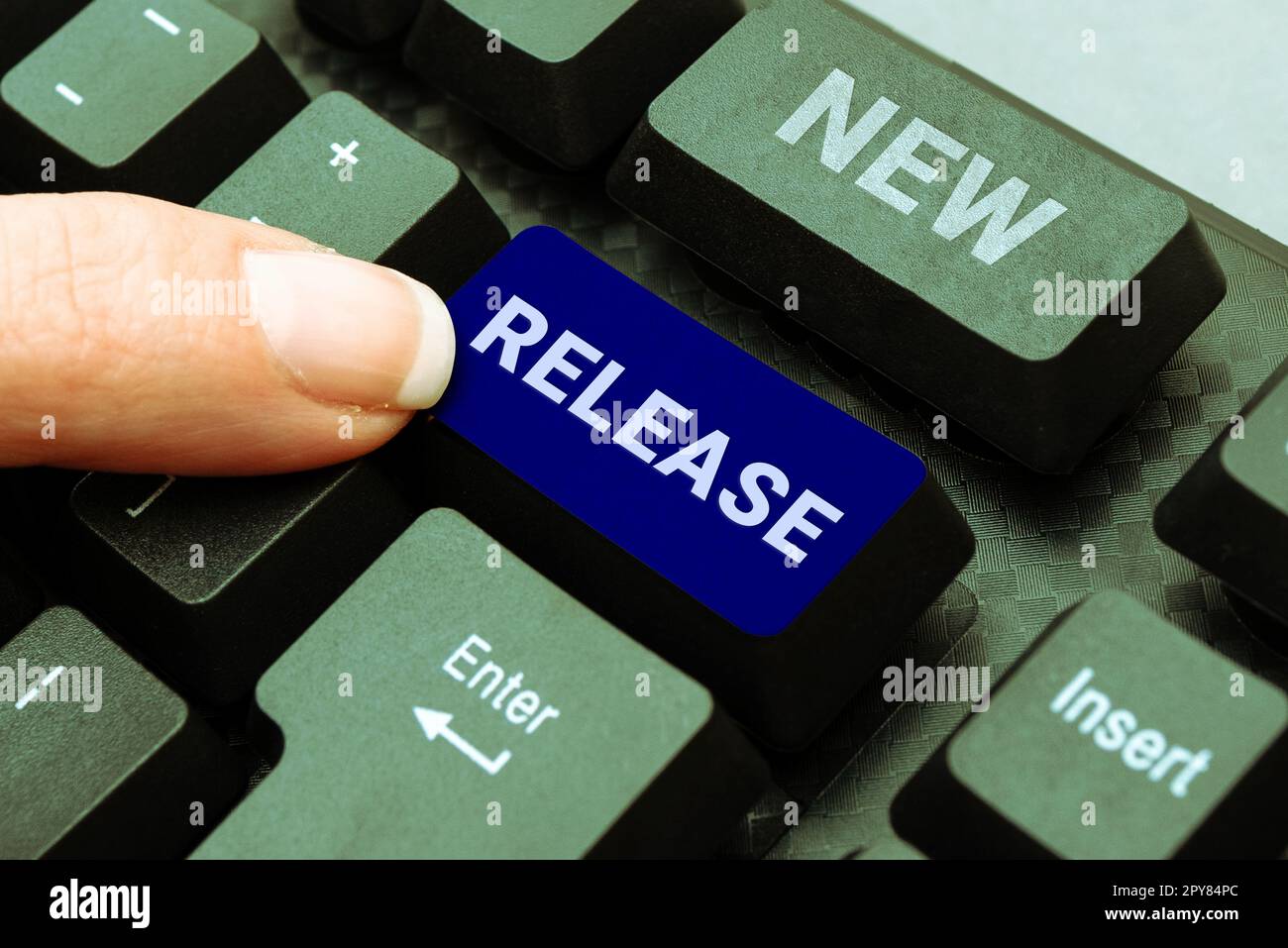 Hand writing sign New Release. Word Written on announcing something ...