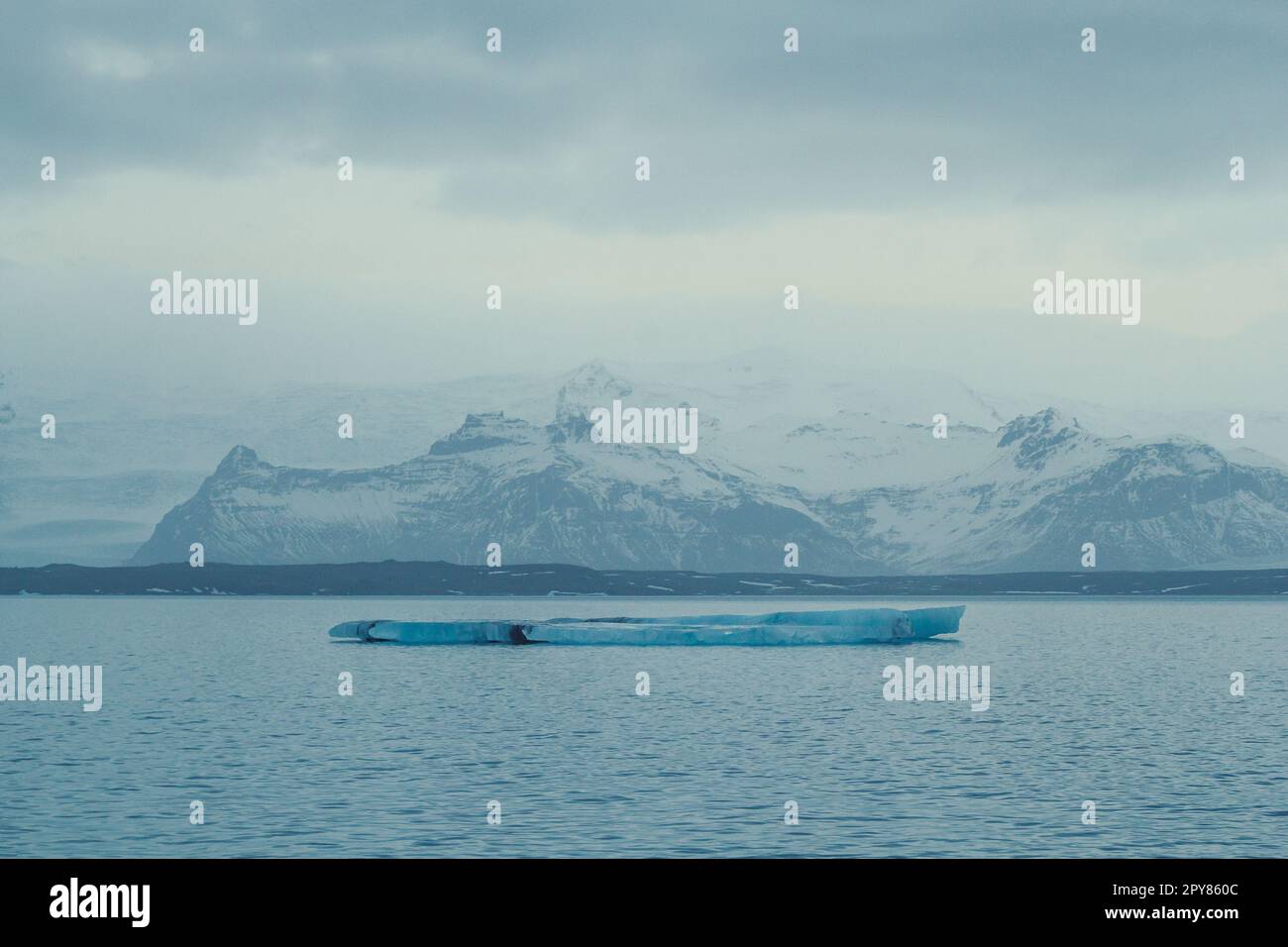 Flat iceberg floating in sea landscape photo Stock Photo - Alamy