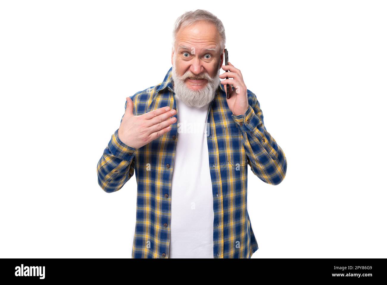 smiling 50s mid aged gray-haired man with a beard talking on a mobile ...